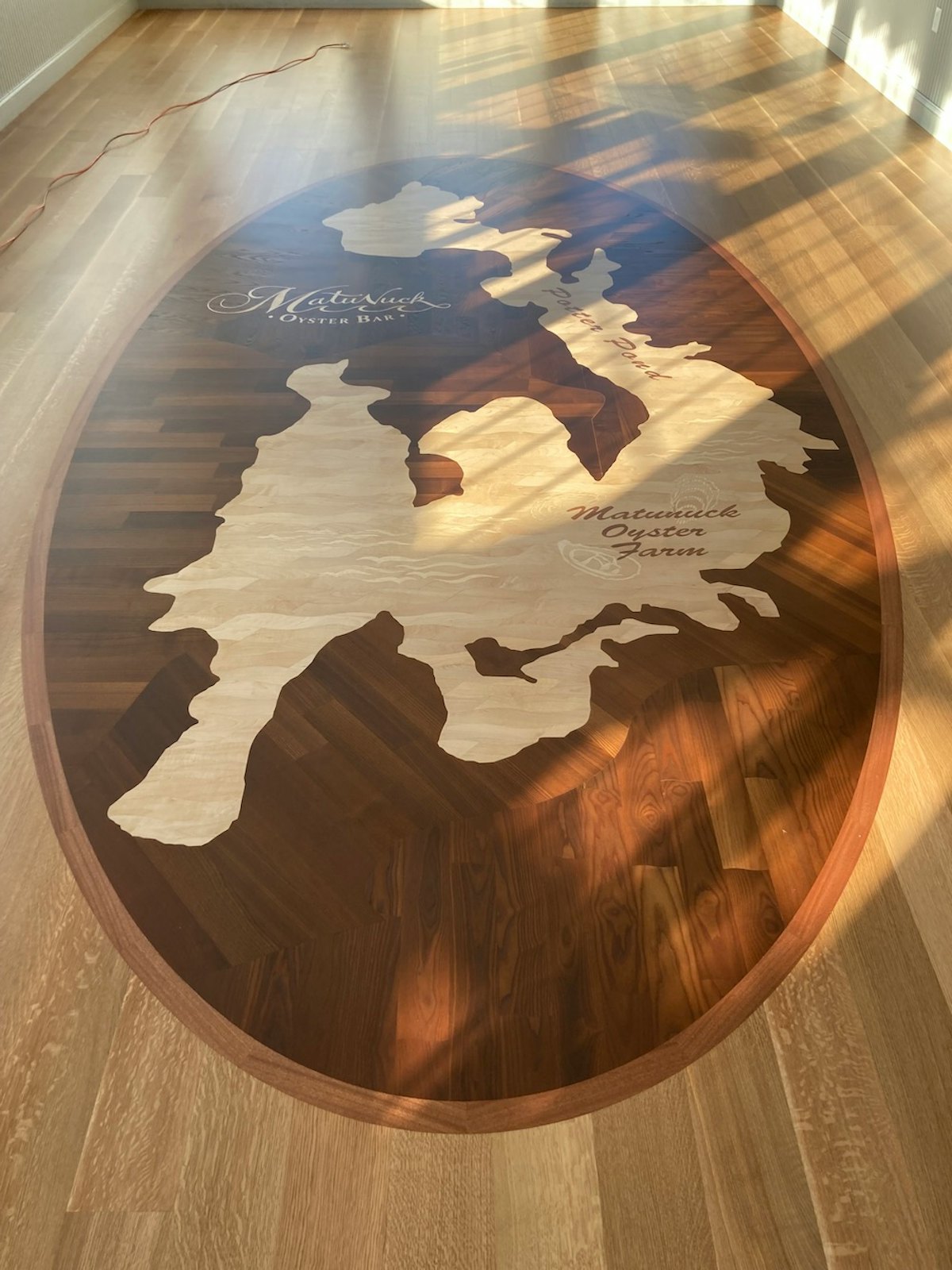 Oyster Bar Floor Medallion Makes Waves | Wood Floor Business