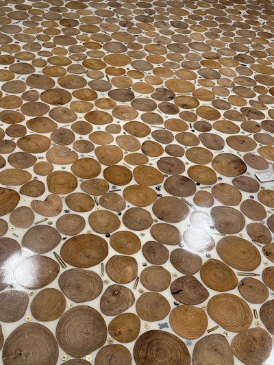 Log Rounds Are a Bullseye for Outdoorsman’s Floor | Wood Floor Business